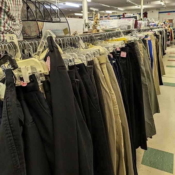 Pants hanging in formation, waiting to become someone's new favorite jeans without requiring a second mortgage.