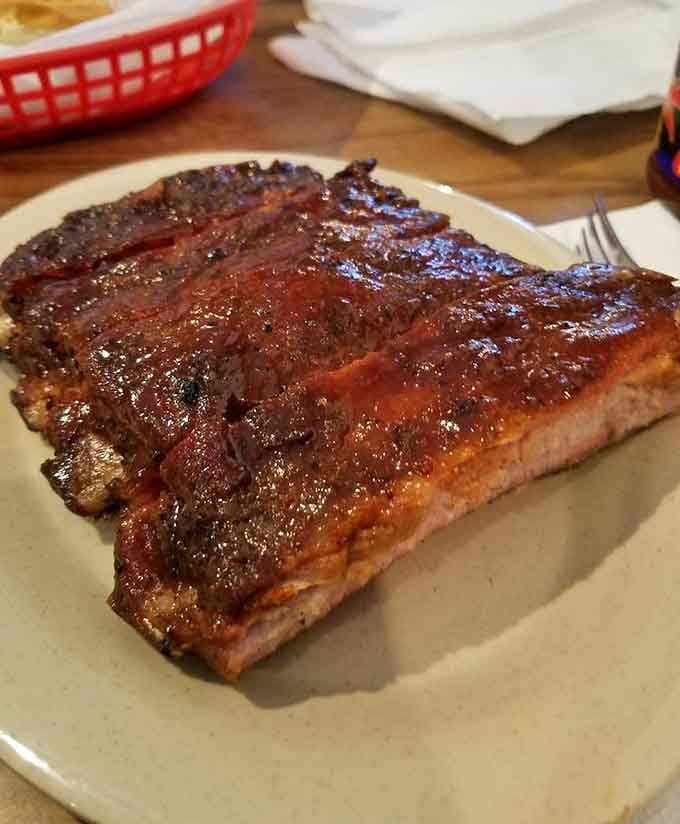 That gorgeous smoke ring and caramelized bark make these St. Louis ribs pure edible poetry.