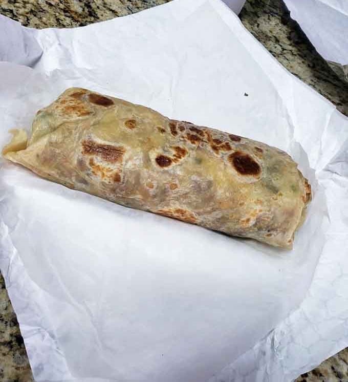 That's not a burrito, that's a commitment wrapped in a tortilla with beautiful golden char marks.