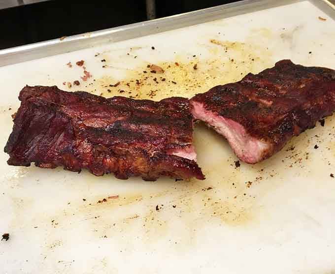 These ribs have a smoke ring that tells the truth: someone actually cared enough to do this right.