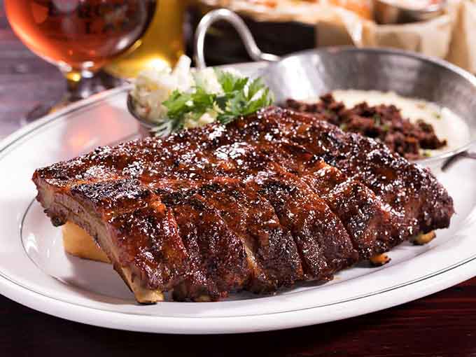 These smoked baby back ribs are so tender they practically fall off the bone before you touch them.