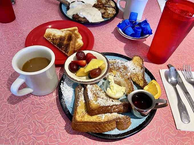 French toast dusted with powdered sugar and served with fresh fruit—because mornings deserve this kind of sweetness and joy.