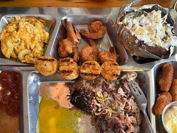 Pulled pork, fried shrimp, and sides create a surf-and-turf symphony that'll make your taste buds sing harmony.
