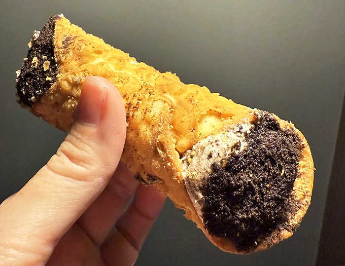 Chocolate-dipped ends and that golden shell make this cannoli look like it's dressed for the Oscars.