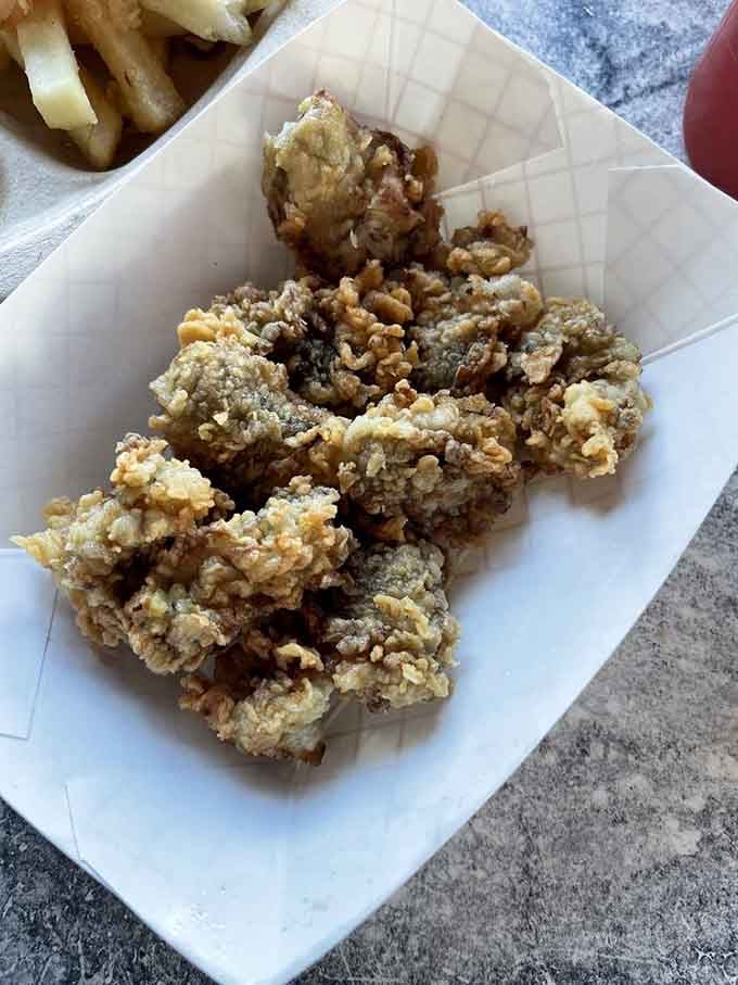 Golden, crispy fried oysters that crunch like autumn leaves but taste infinitely better, proving that sometimes perfection comes in a paper basket.