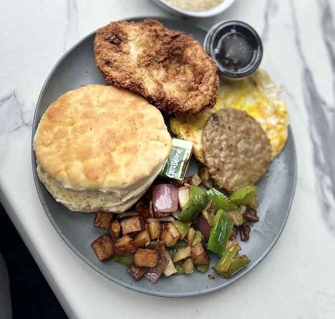Southern comfort meets California cool with biscuits, sausage, and perfectly crispy hash browns on one plate.