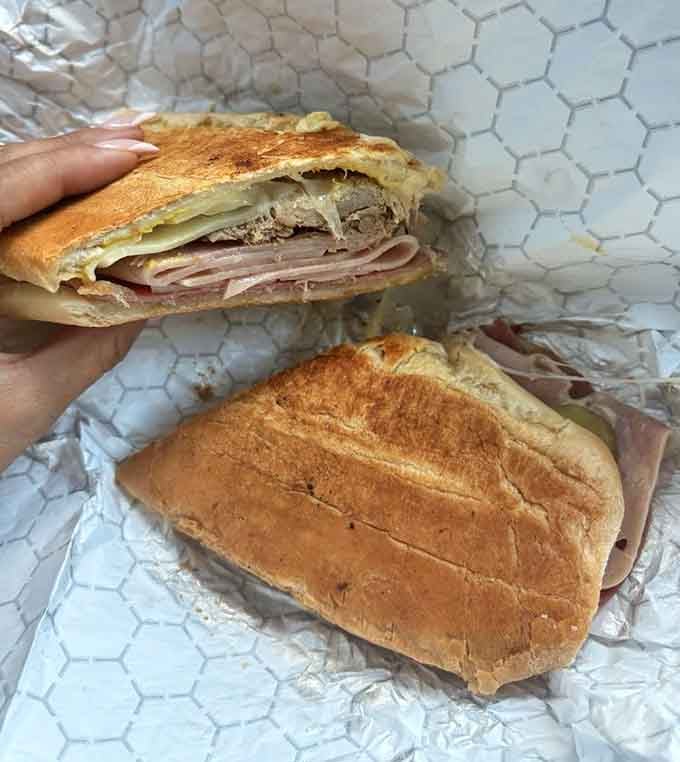 Behold the Cubano: layers of pork, ham, and Swiss pressed into golden perfection that'll ruin chain sandwiches forever.