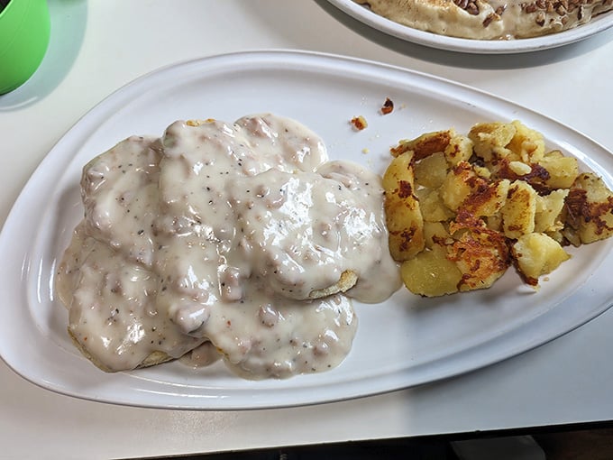 Biscuits drowning in peppery gravy alongside golden hash browns is the breakfast equivalent of a standing ovation.
