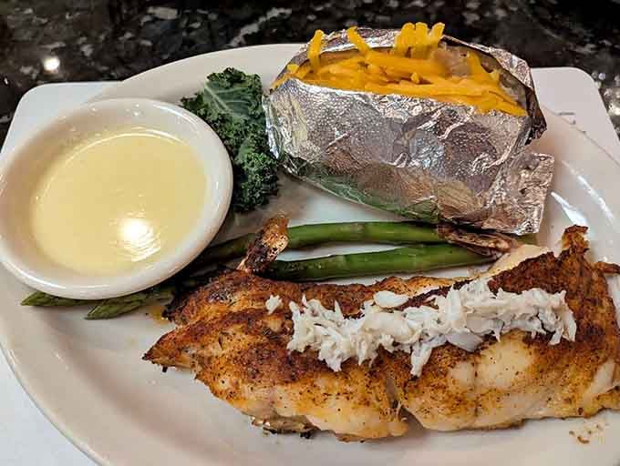 The stuffed snapper arrives like edible architecture, crowned with crabmeat that justifies loosening your belt an extra notch.