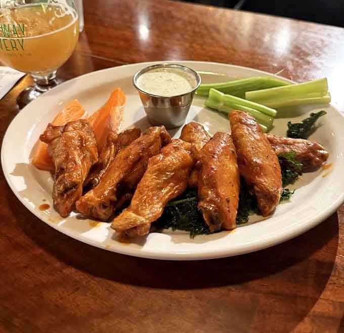 Wings glazed to perfection, served with cooling ranch and crisp vegetables for the complete experience.