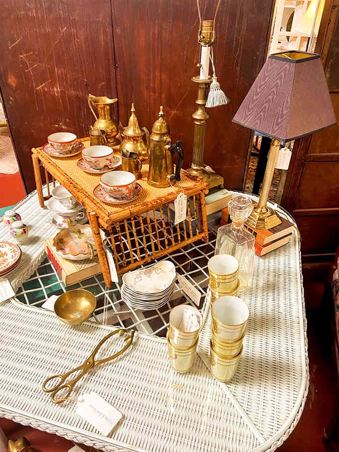 Brass teapots and delicate china living together in perfect harmony, like a vintage dinner party frozen in time.