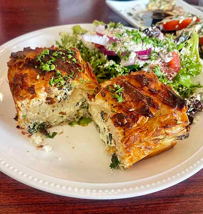 Golden phyllo layers hiding savory treasures alongside that crisp salad, this is brunch done right with Mediterranean flair.