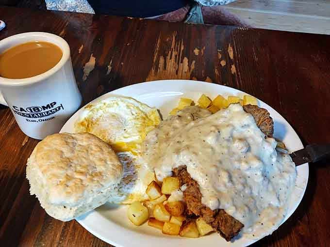 Country fried steak smothered in gravy: because sometimes you need breakfast that doubles as a weighted blanket for your stomach.