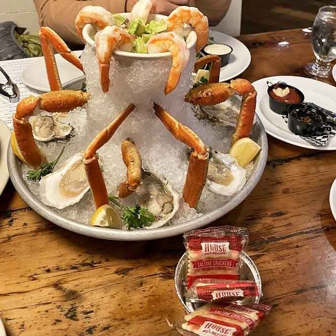 This seafood tower is basically the Eiffel Tower of crustaceans. Shrimp, crab legs, and oysters stacked like edible architecture.