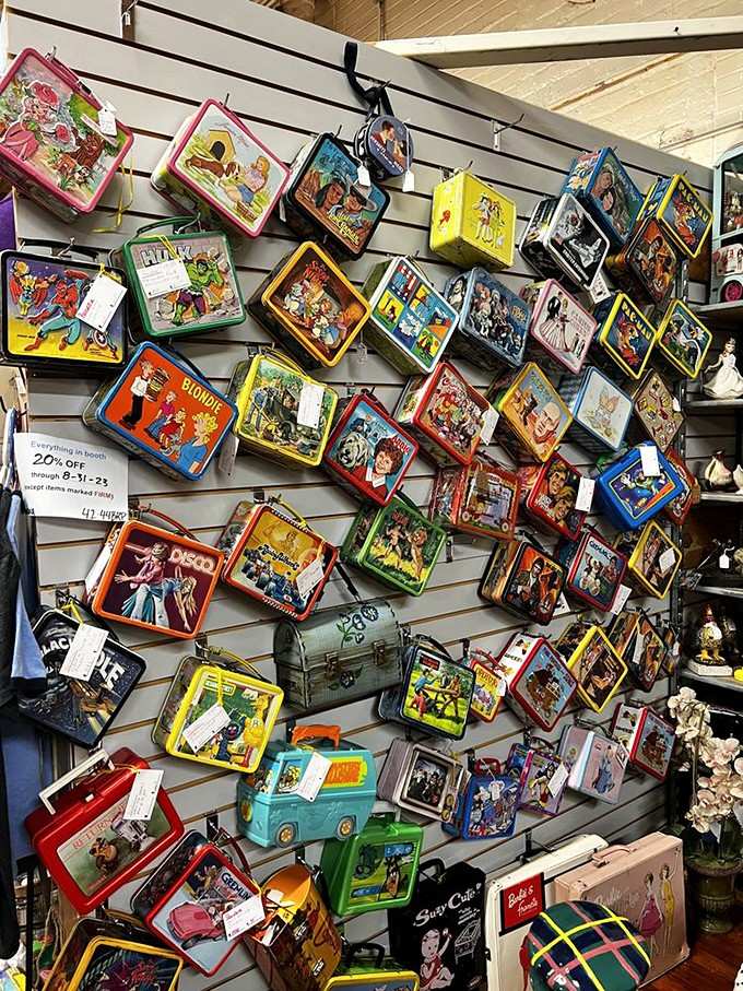 Metal lunch boxes featuring cartoon characters line the wall like a nostalgic art installation from your elementary school days.