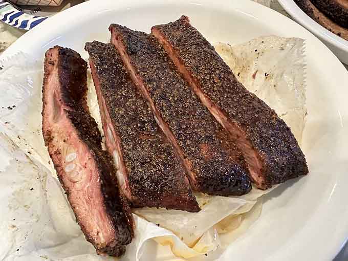 These pork ribs have that perfect bark and smoke ring that would make any pitmaster weep with joy.