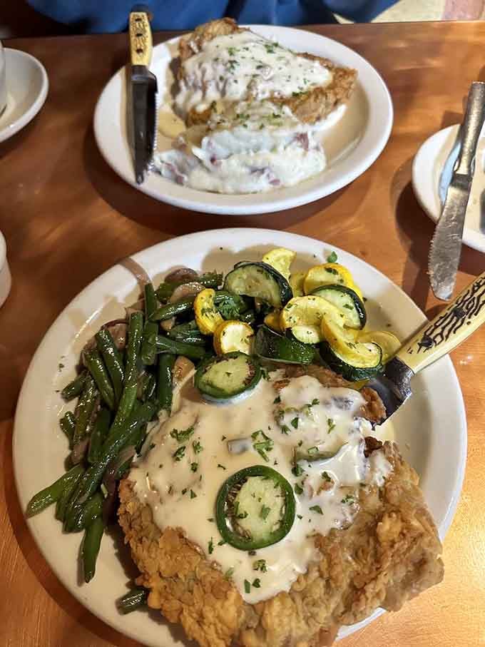 Chicken fried steak so generous it practically requires its own zip code, served with all the fixings.