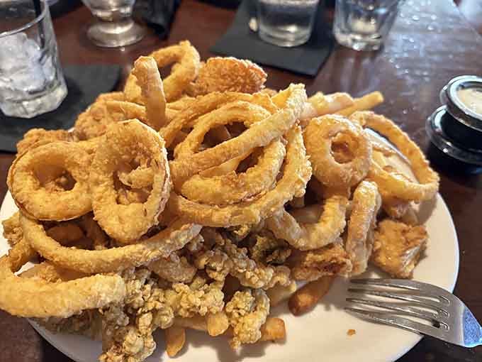 This golden mountain of fried perfection includes clams, onion rings, and enough crispy goodness to make you weep with joy.
