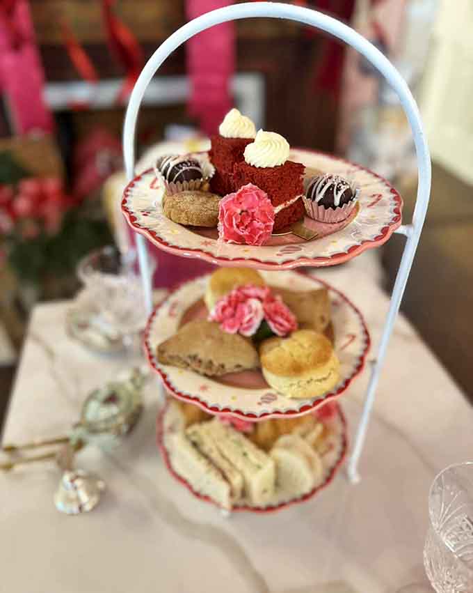 The three-tiered tray arrives like an edible work of art, proving good things really do come in small packages.