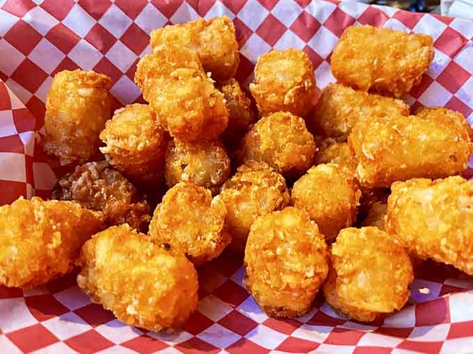 Golden tater tots achieve crispy perfection, proving that sometimes the simplest pleasures are the most satisfying ones.