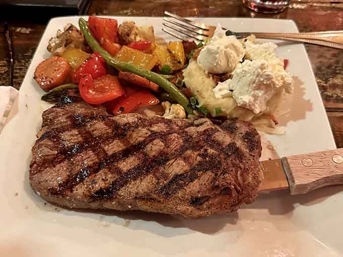 Perfectly grilled steak with roasted vegetables and creamy mashed potatoes &ndash; surf and turf's land-loving cousin looking absolutely magnificent on the plate.