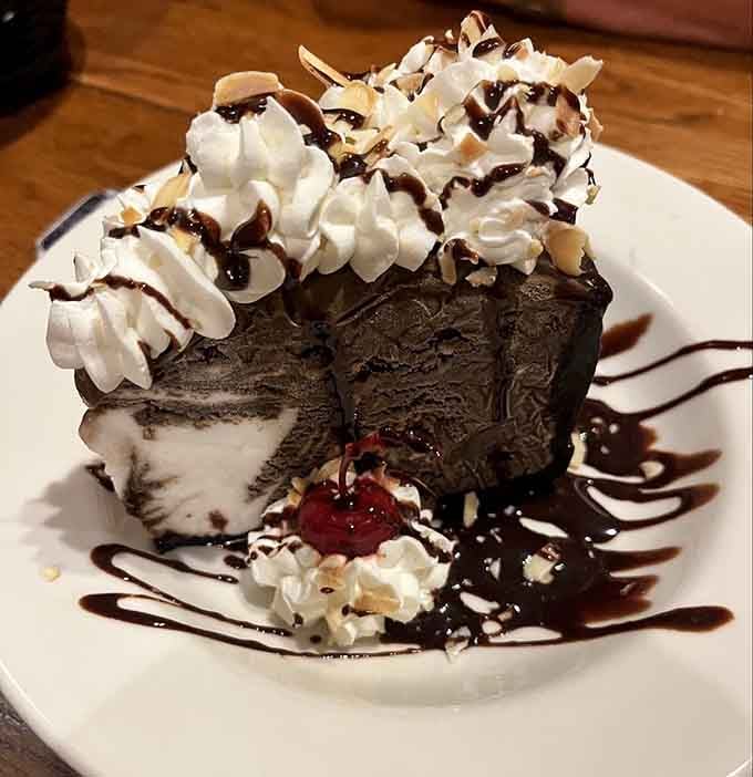 The Mud Pie towers like a chocolate monument to the idea that dessert calories absolutely do not count on vacation.