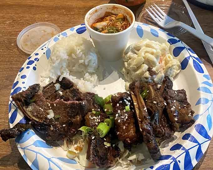 Ribs so tender they're practically waving goodbye to the bone, served with sides that earn their supporting role.