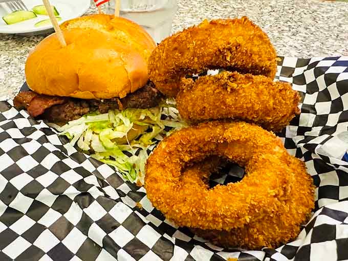 Golden onion rings the size of steering wheels paired with a burger that means serious business&mdash;this is commitment food.