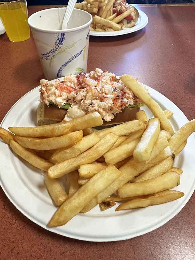 That lobster roll sits on its bun like a crown jewel, generous and unapologetic.