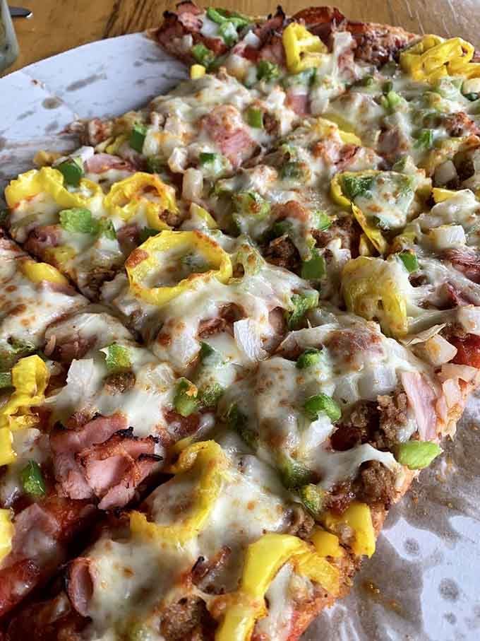 The Cristy's Classic loaded with pepperoni, sausage, peppers, and mushrooms proves combination pizzas earned their legendary status.