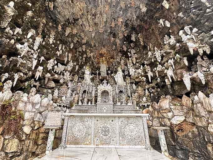 Brother Joseph's grotto shrine sparkles with found treasures, proving one person's junk truly becomes another's masterpiece of devotion.