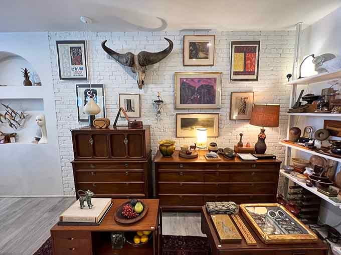 Vintage furniture meets gallery wall vibes, because apparently thrift stores can have interior designers now.