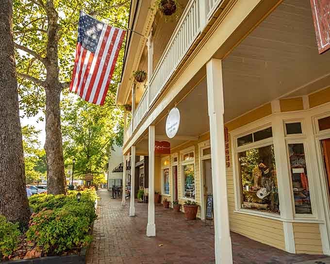 The covered sidewalks offer shade for window shopping, because apparently someone here actually thought about pedestrian comfort in the planning stages.