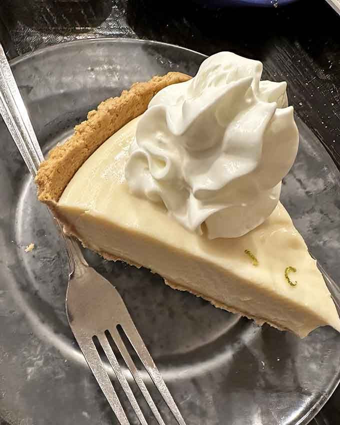 Key lime pie topped with clouds of whipped cream is how you end a seafood feast properly.