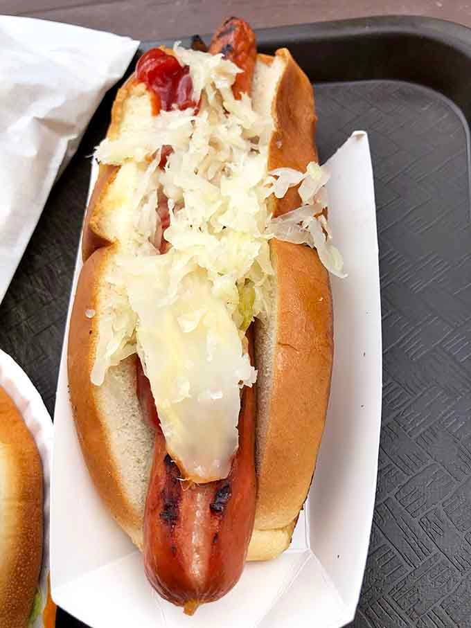 Behold the foot-long hot dog in its natural habitat, topped with sauerkraut like nature intended all along.