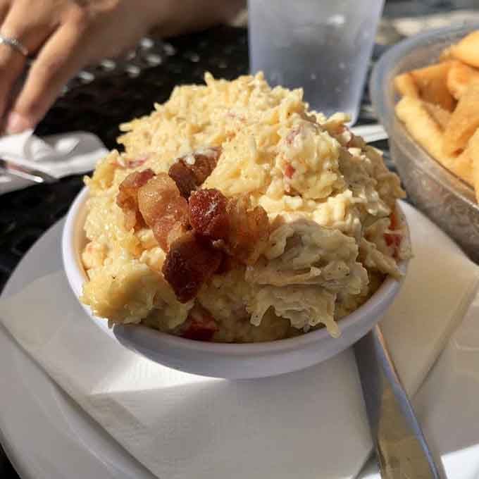 Behold the legendary pimento cheese in all its glory, piled high enough to make your cardiologist nervous.