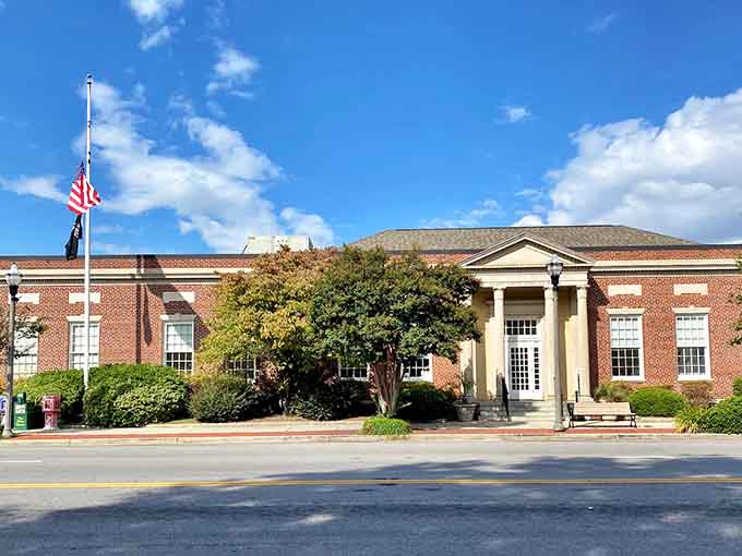 Even the post office looks dignified here, because apparently Dillon believes every building deserves architectural respect.