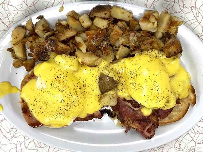 Eggs Benedict so perfectly sauced it could make hollandaise haters reconsider their entire life philosophy.