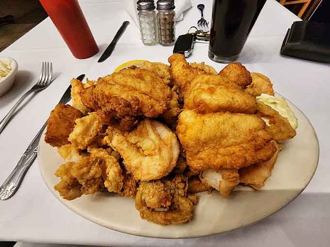 A glorious mountain of golden fried seafood that would make any New England fisherman proud of the catch.