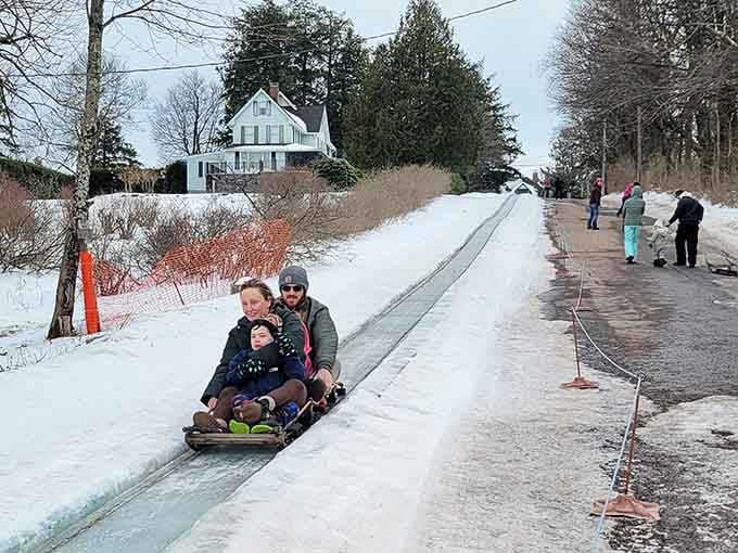 Nothing says "I trust my life choices" quite like hurtling down an icy chute on a wooden sled.