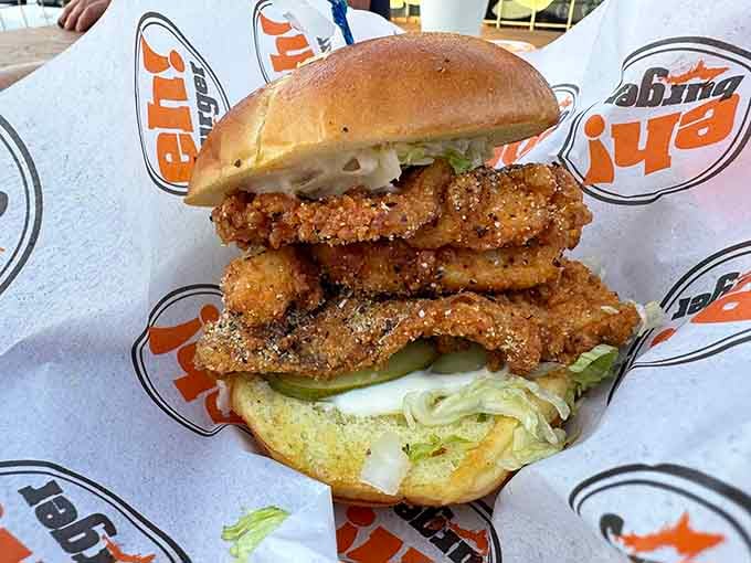That golden-breaded whitefish stacked high on a bun proves Lake Superior's bounty belongs on burgers too, not just dinner plates.