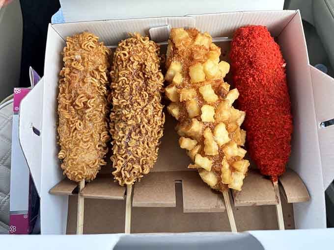 Korean corn dogs in all their glory: ramen-crusted, potato-studded, Cheetos-coated, and gloriously over-the-top in the best way.