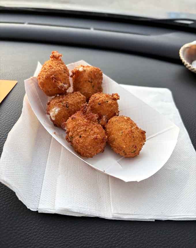 Golden hushpuppies that could make a grown person weep with joy, crispy outside and tender within.