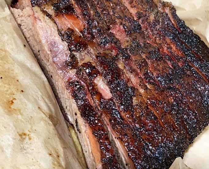 That smoke ring and bark could make a vegetarian reconsider their entire life philosophy in one glorious bite.