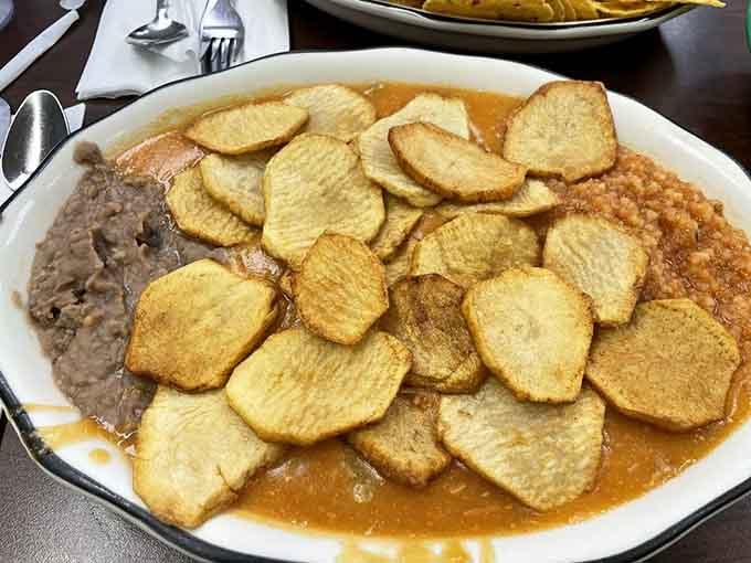 Golden papas arranged like edible poker chips surround pools of legendary green chile that'll change your breakfast game forever.