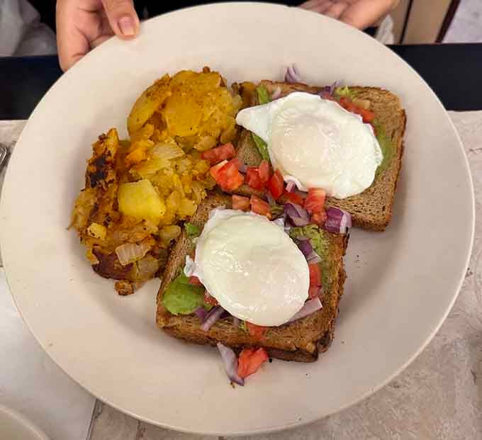 Avocado toast with poached eggs proves even classic diners can embrace modern brunch trends without losing their soul.