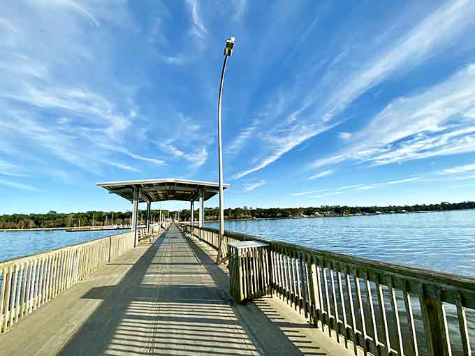 The pier stretches into Mobile Bay like an open invitation to forget your to-do list entirely.