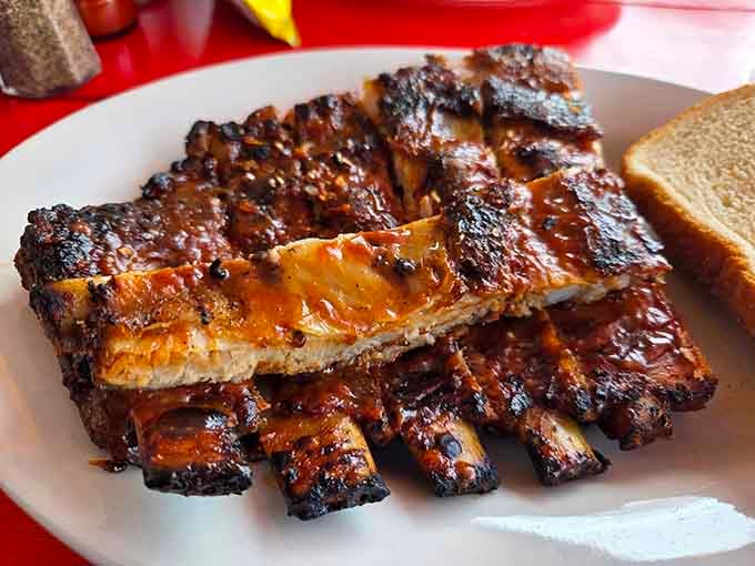 Ribs so tender they're practically waving goodbye to the bone before you even pick up your fork.