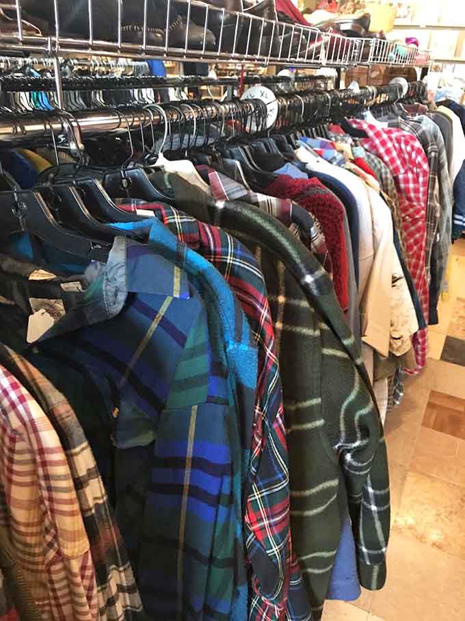 Rows of flannel shirts in every plaid pattern imaginable, because apparently someone saved every lumberjack look from the past fifty years.