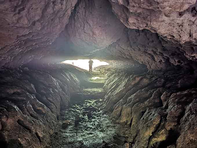 Standing inside the earth while light pours in feels like discovering a portal to somewhere magical.